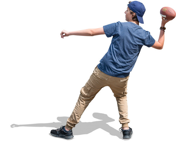 A Boy Throwing A Football